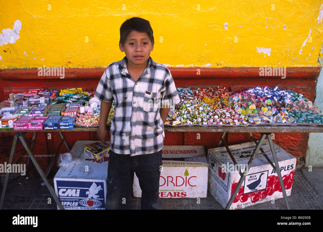 A young boy selling sweets on a street stall in El Salvador Stock Photo ...