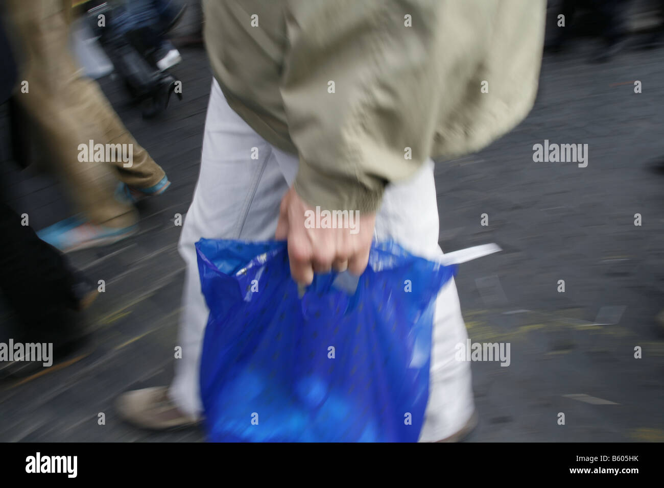 man shopper with plastic bag in town Stock Photo - Alamy