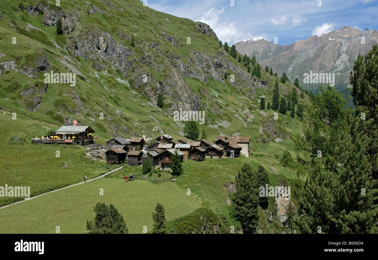 The small hamlet of Zmutt nestling in the alpine landscape above ...