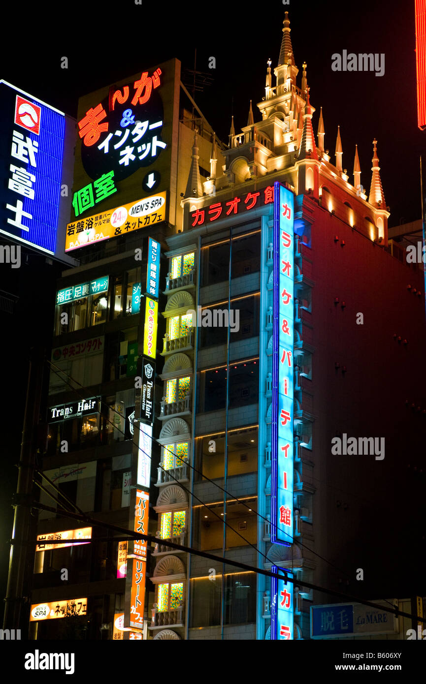 Neon signs on a building in Shinjuku at night, Tokyo, Japan Stock Photo ...