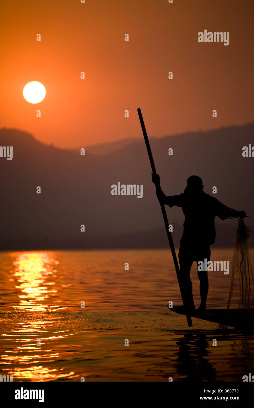 Leg rower traditional fishing at the sunset Inle Lake Myanmar Asia ...