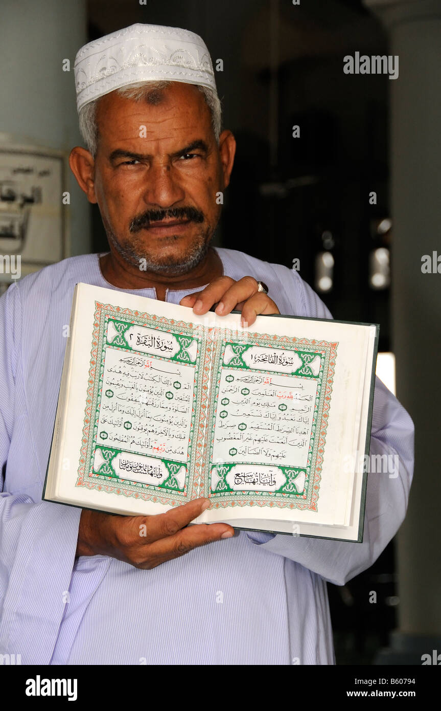muslim holding koran in mosque Stock Photo - Alamy