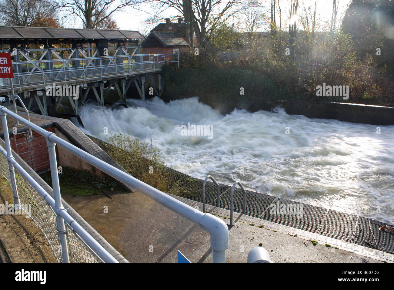 Weir in full flow Stock Photo - Alamy