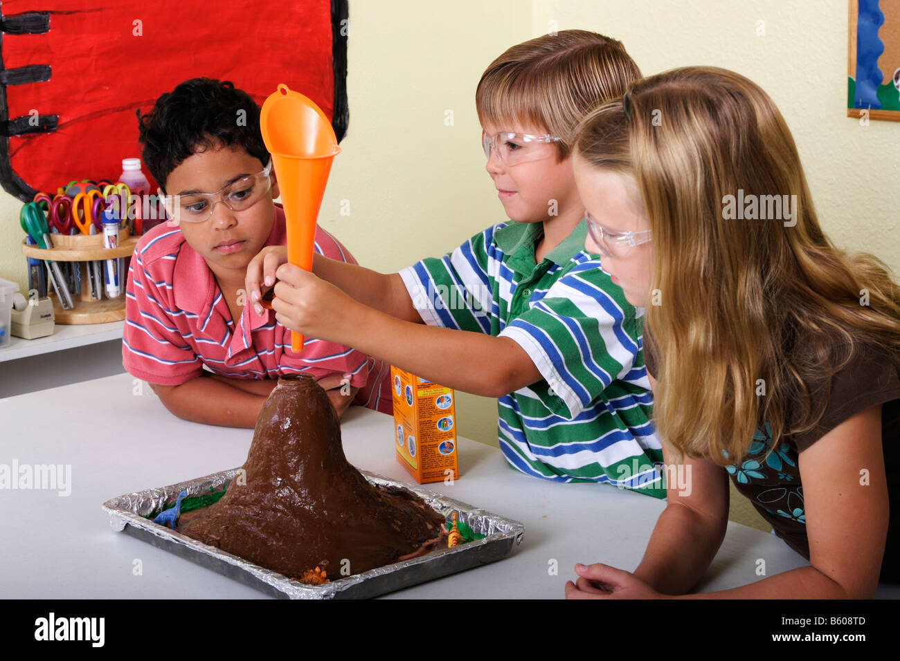 School kids working on a volcano science project Stock Photo - Alamy