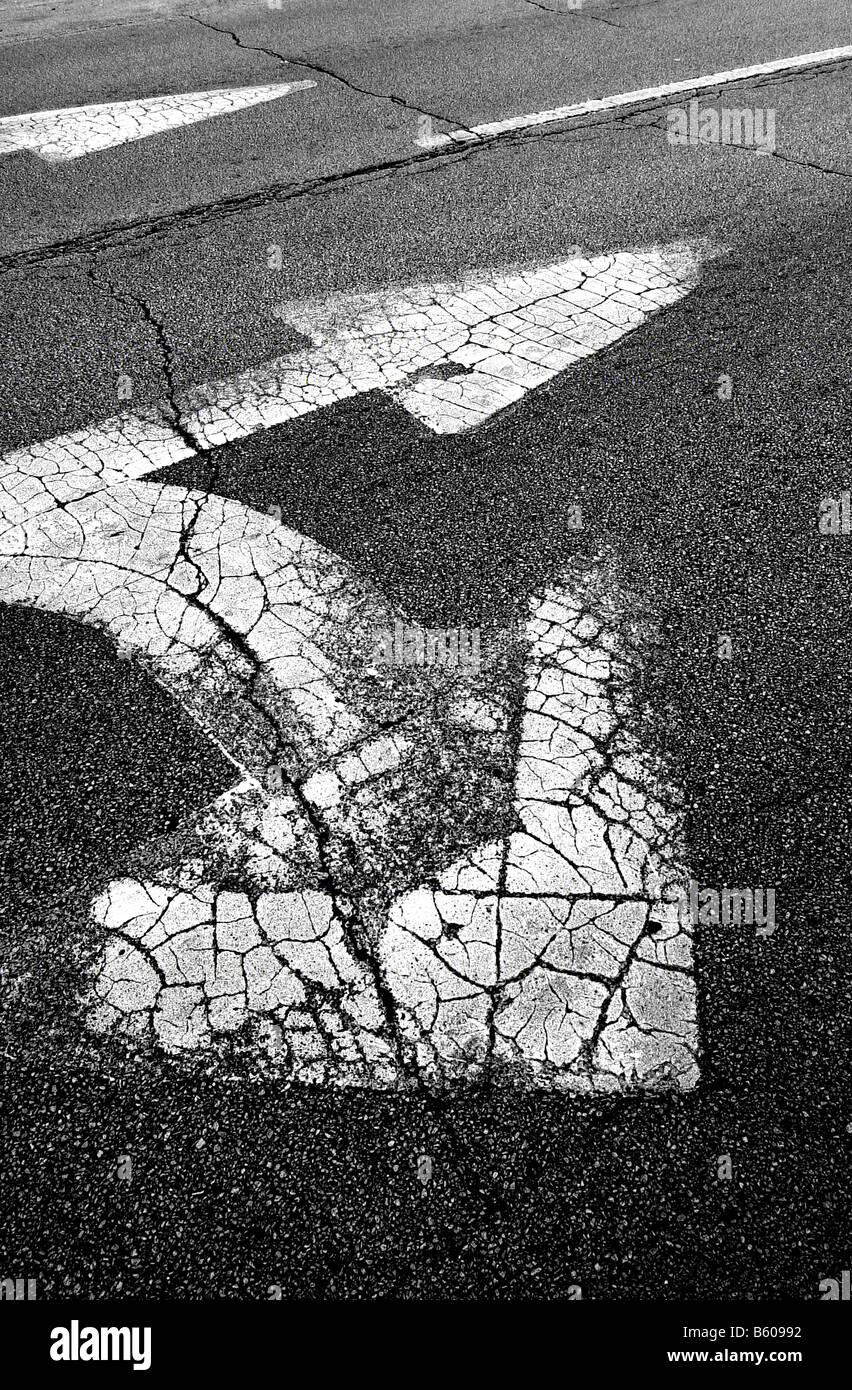 Directional arrows on pavement Stock Photo - Alamy
