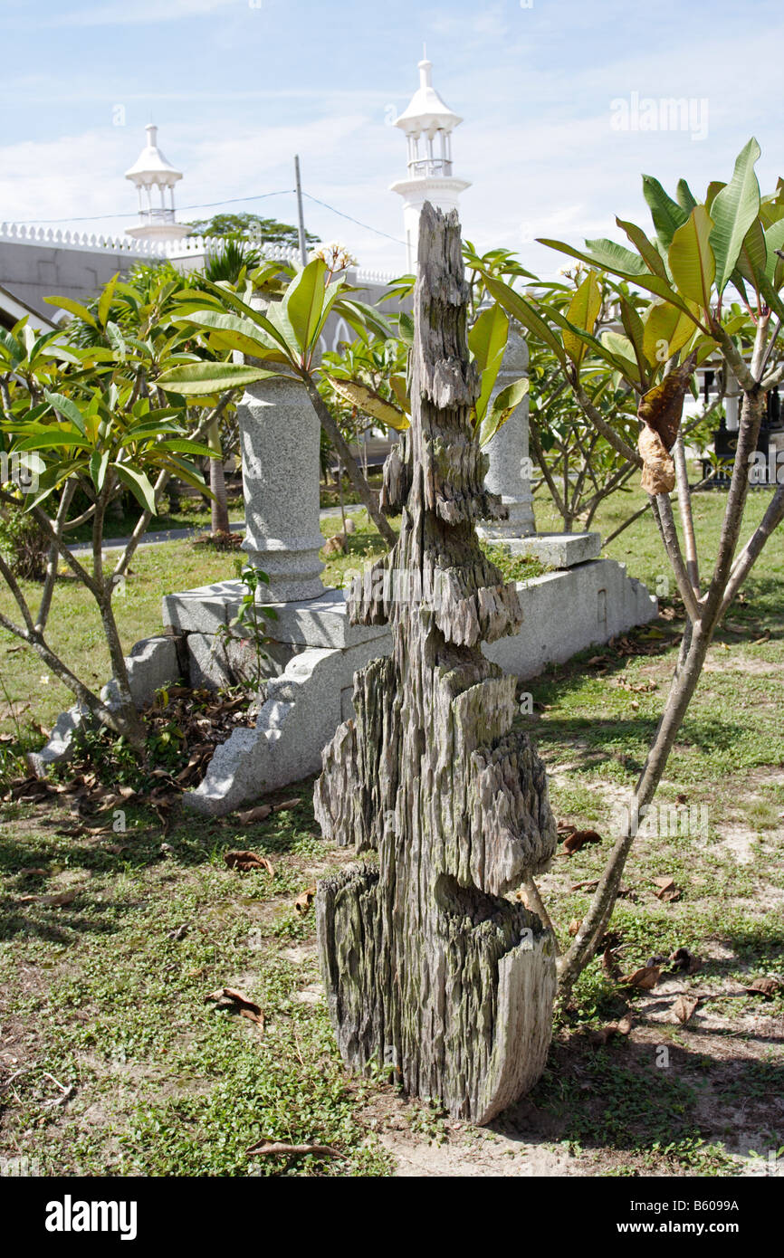Old ancient wooden tombstone in a Malay muslim cemetery in Terengganu ...