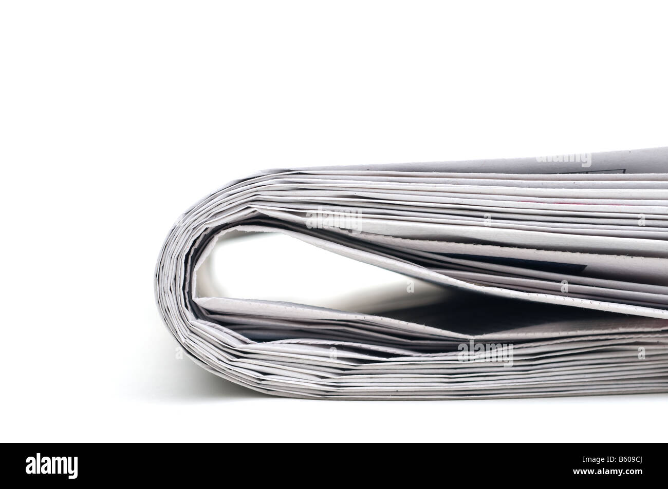 Closeup of the end of a folded newspaper Stock Photo - Alamy