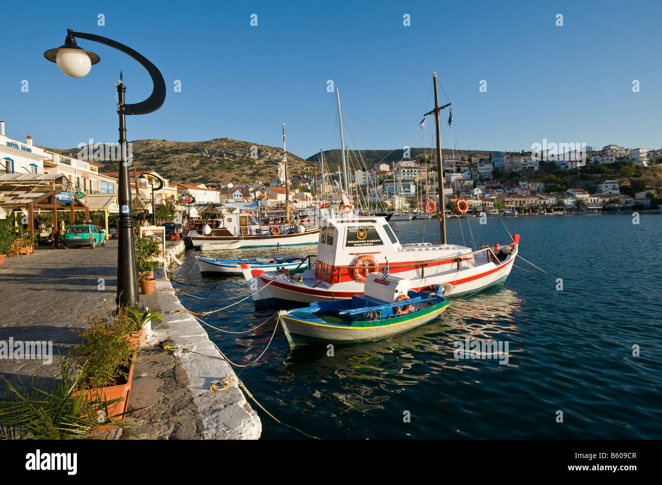 Small fisherman boats in a sunny and picturesque harbour Stock Photo ...