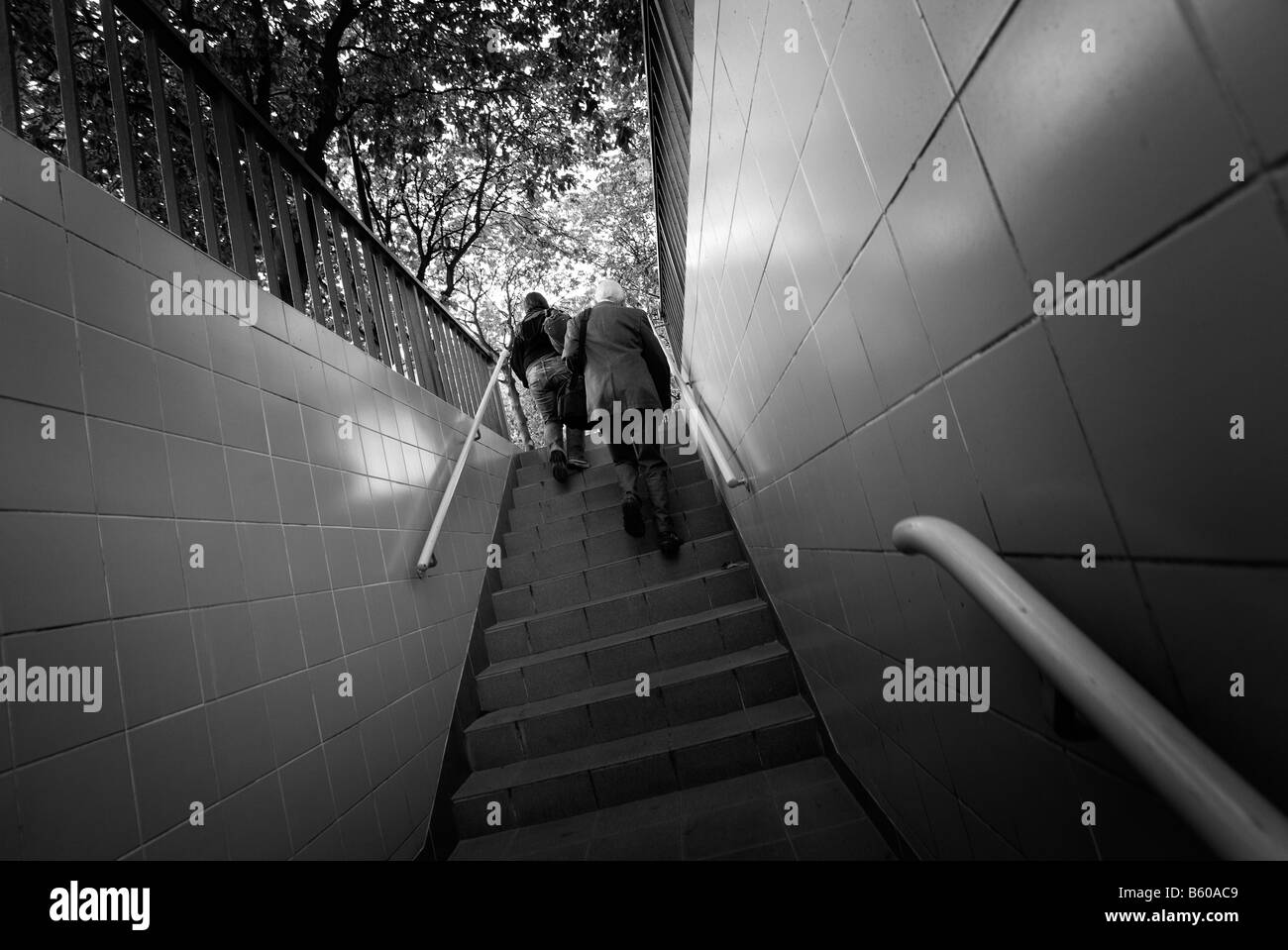 Man climbing stairs Black and White Stock Photos & Images - Alamy