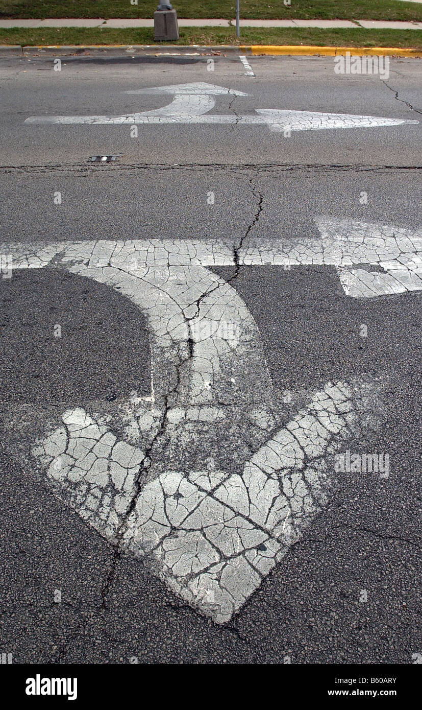Directional arrows on pavement Stock Photo - Alamy