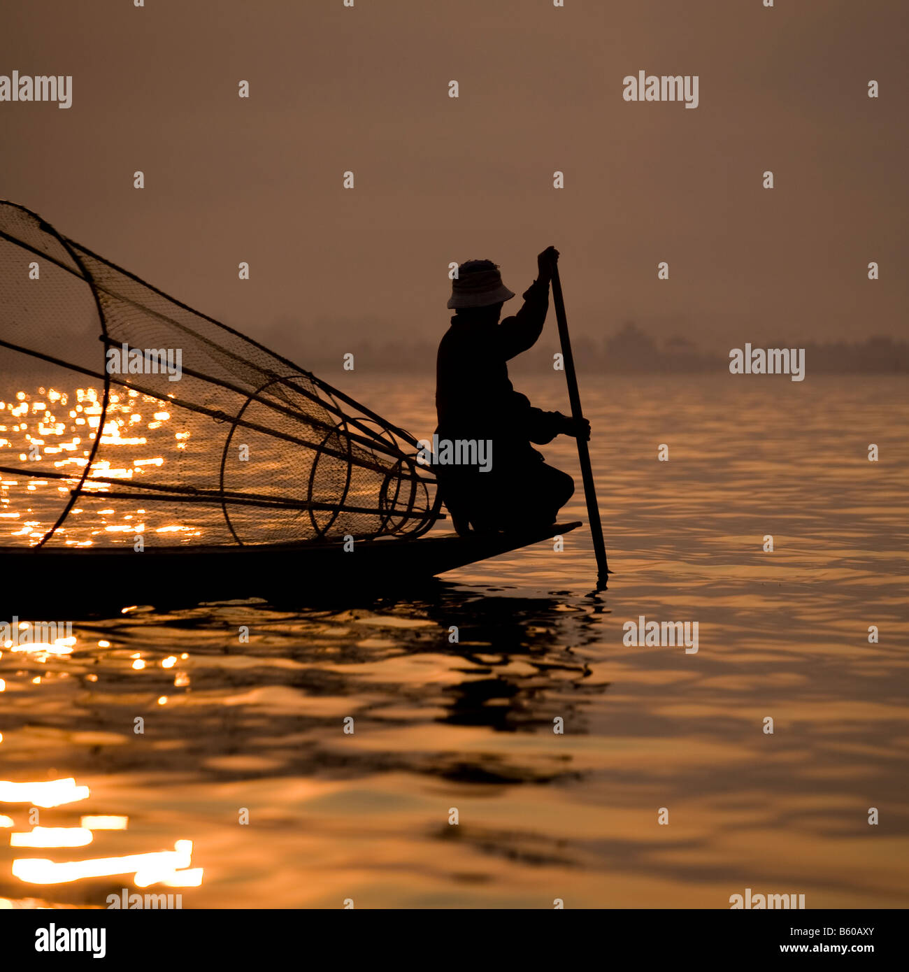 Leg rower traditional fishing at the sunset Inle Lake Myanmar Asia ...