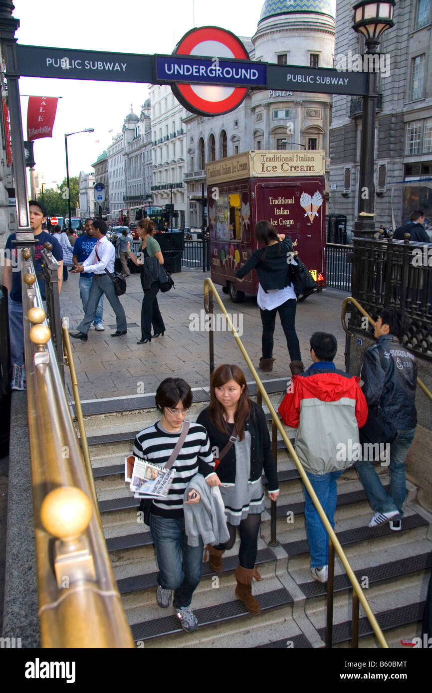 People entering and exiting the London Underground metro system in the ...