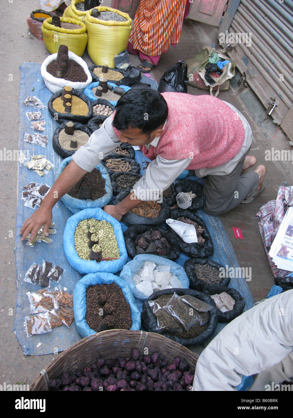 Spice seller at the early morning market in the Indra Chowk area of ...