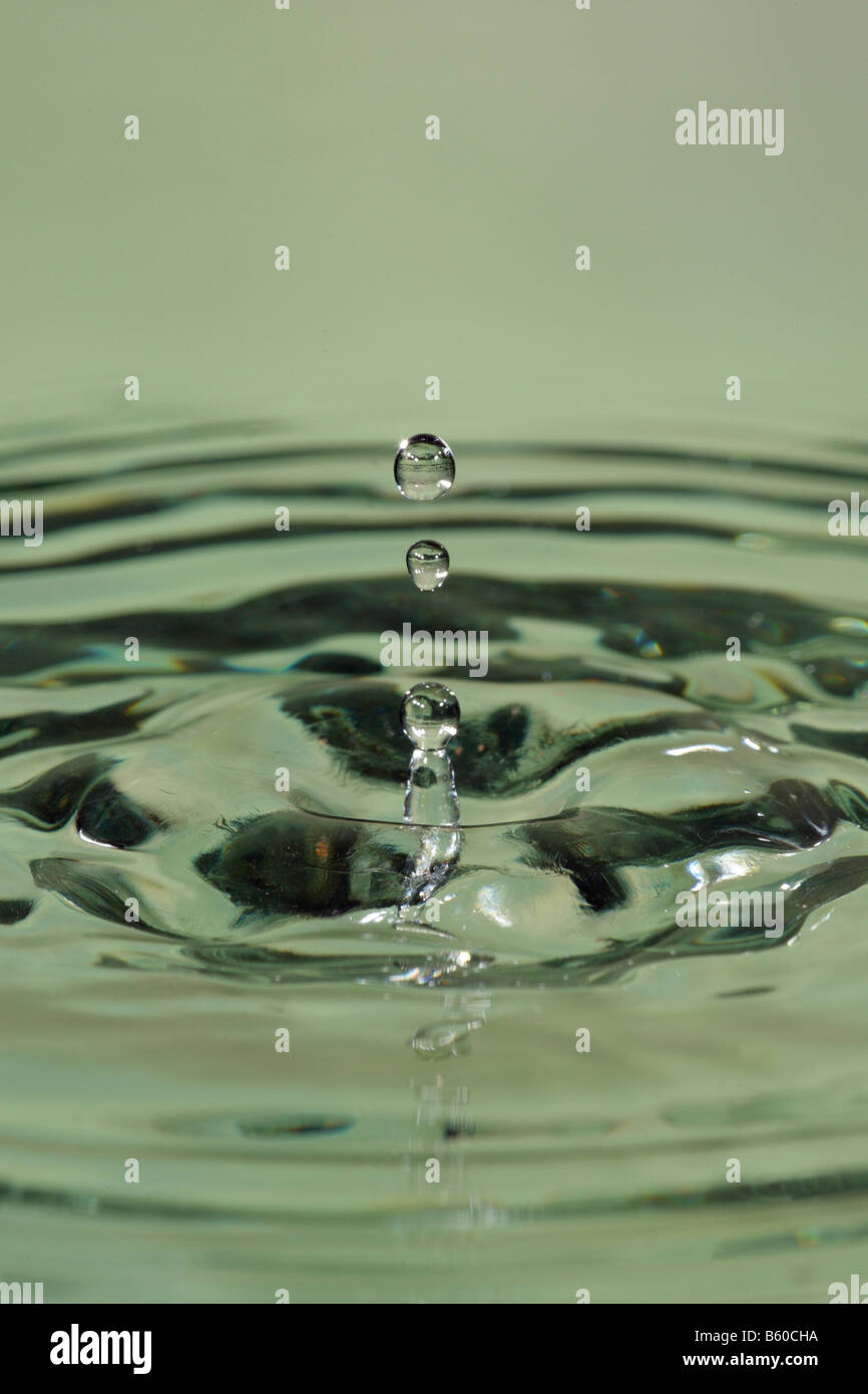 Water drop splashing down Stock Photo - Alamy
