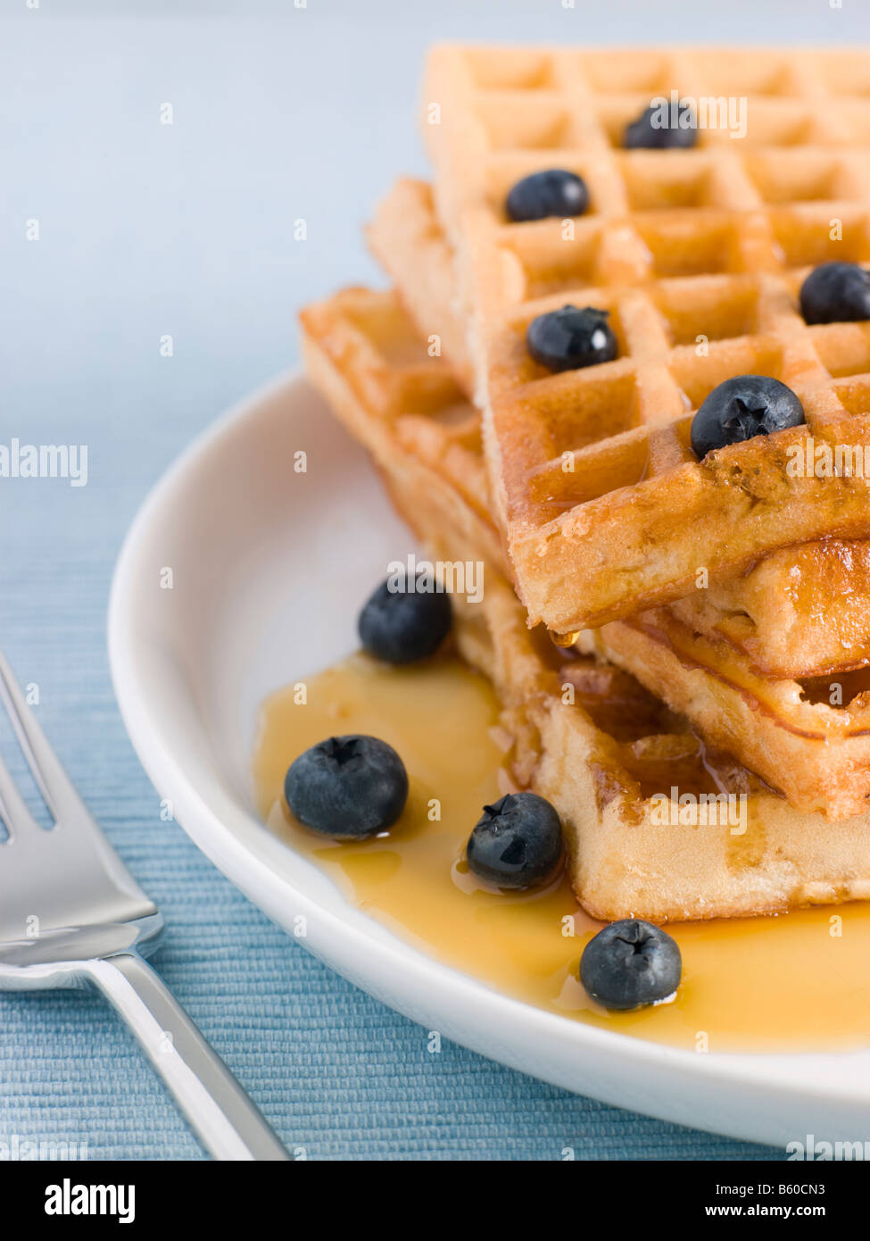 Waffles with Caramel Syrup and Blueberries Stock Photo - Alamy