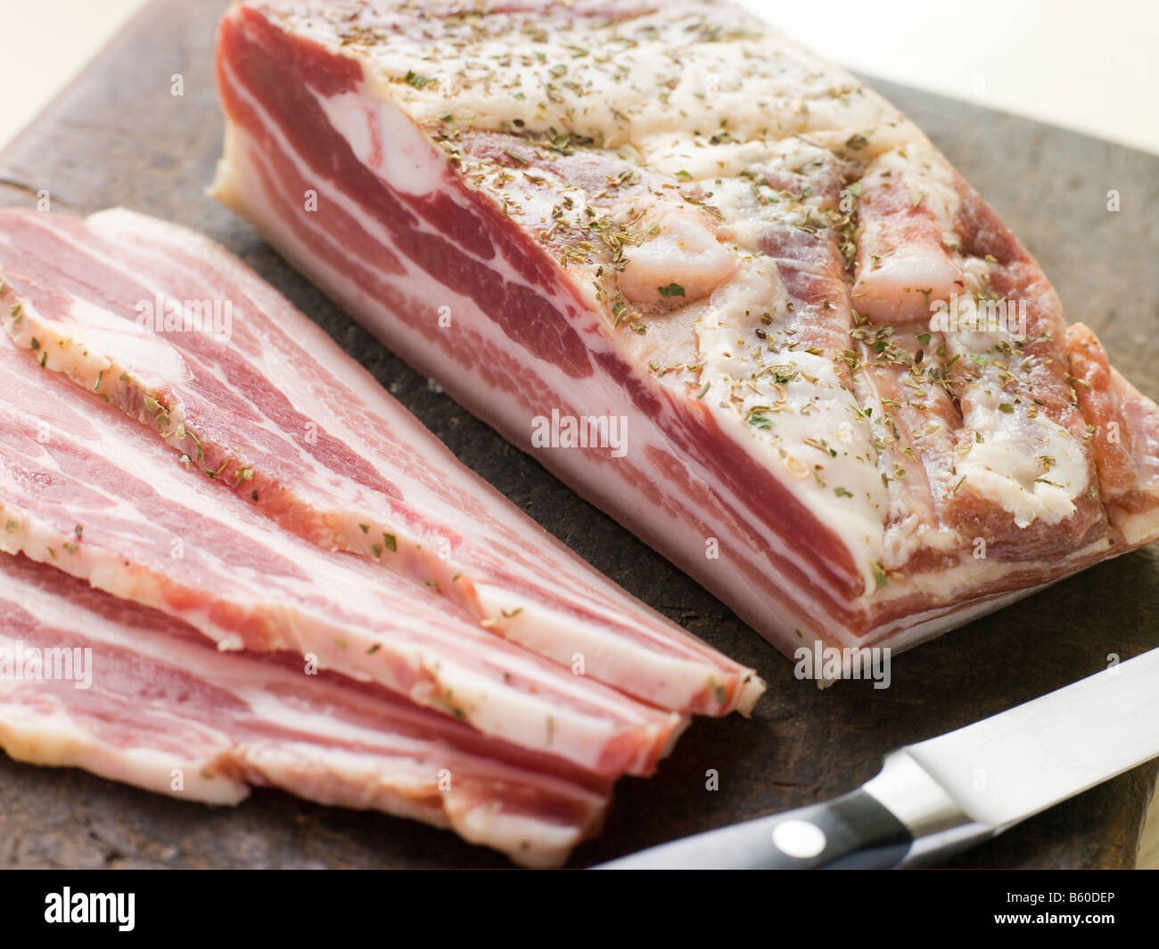 Piece of Pancetta and Slices Stock Photo - Alamy