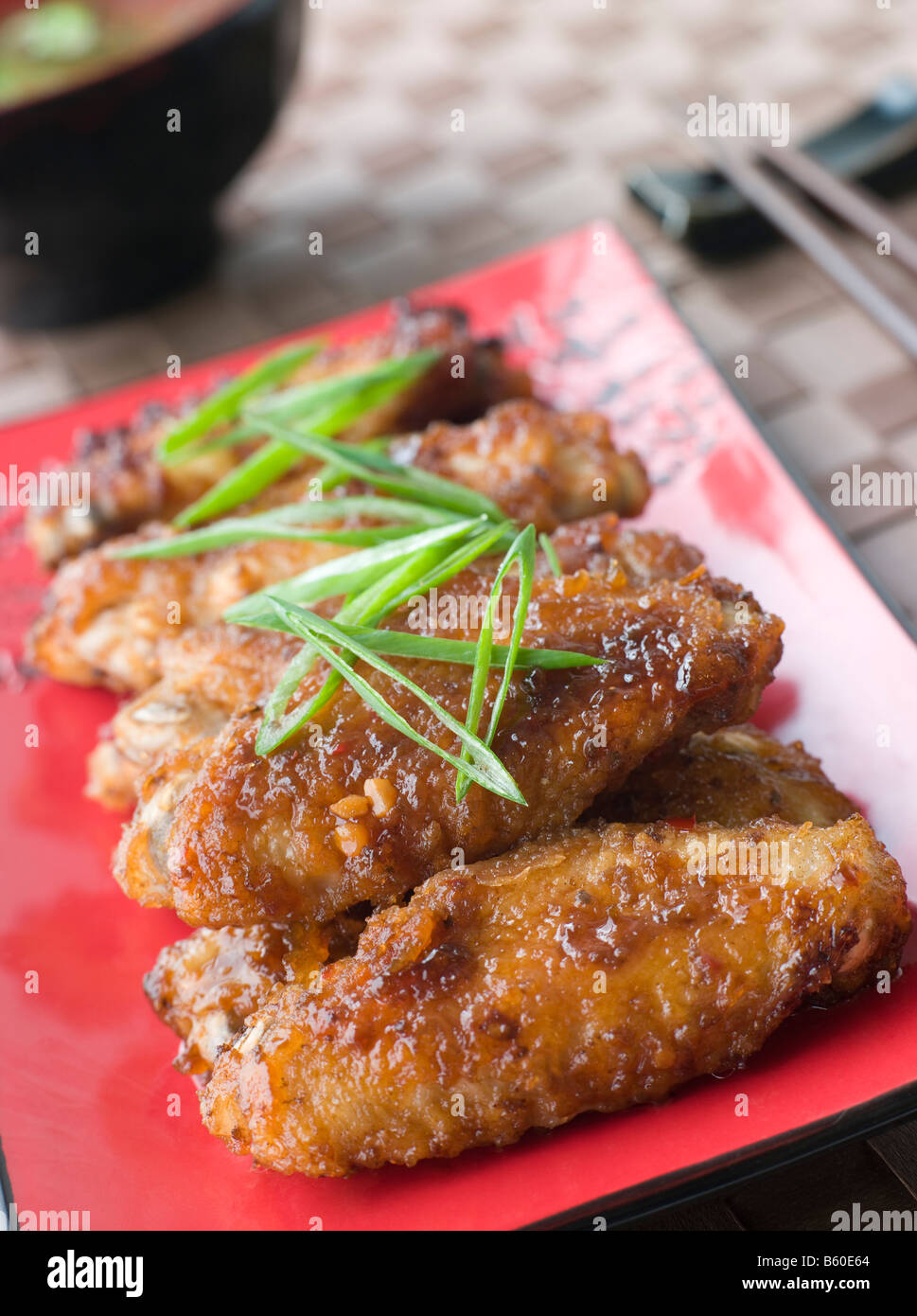 Sweet Spicy Chicken Winglets and Sukiyaki Sauce Stock Photo - Alamy