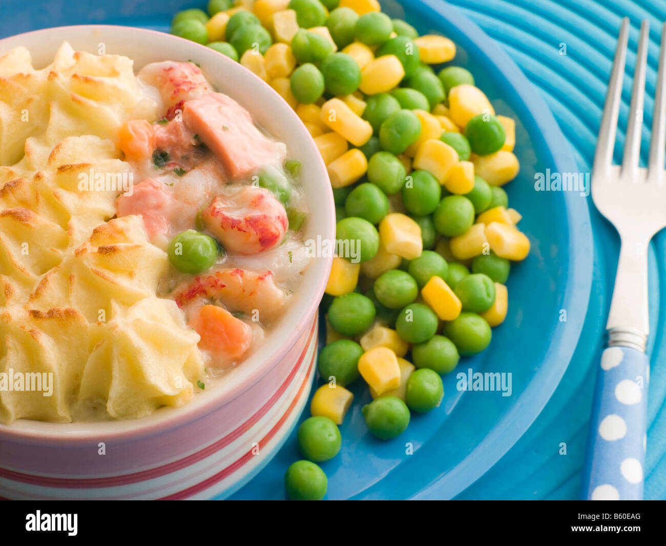 Individual Fish Pie with Peas and Sweetcorn Stock Photo - Alamy