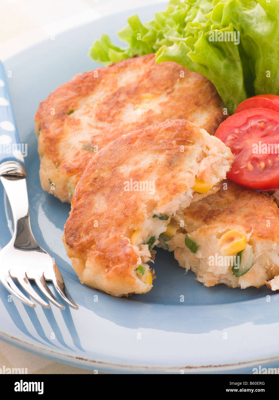 Cod and Salmon Fish Cakes with Corn and Salad Stock Photo - Alamy