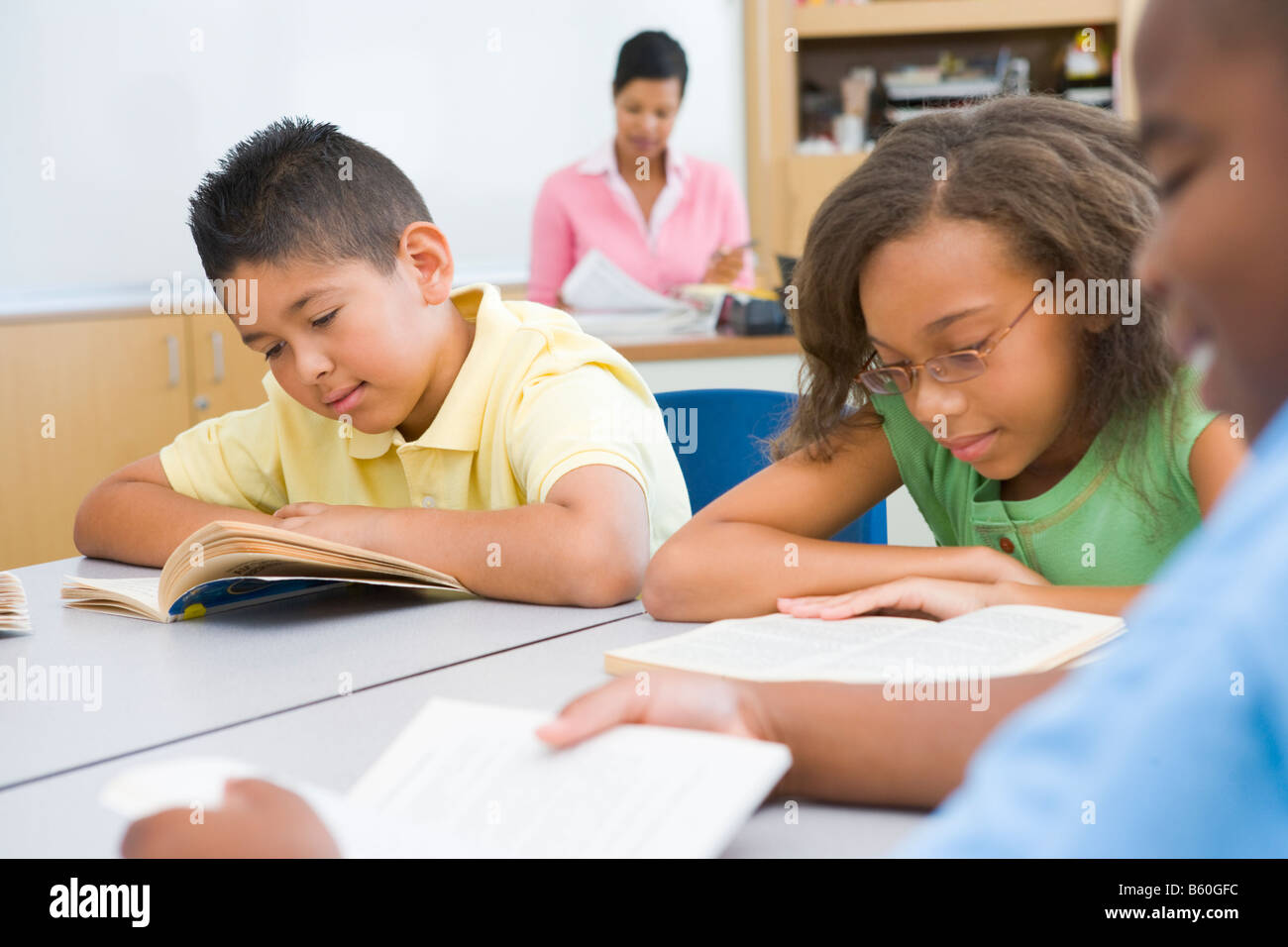 Children Reading Books In Classroom High Resolution Stock Photography ...