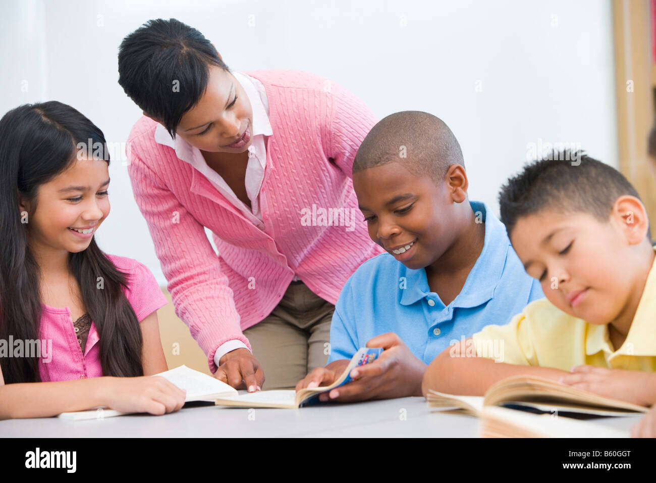 Grade school child teacher reading hi-res stock photography and images ...