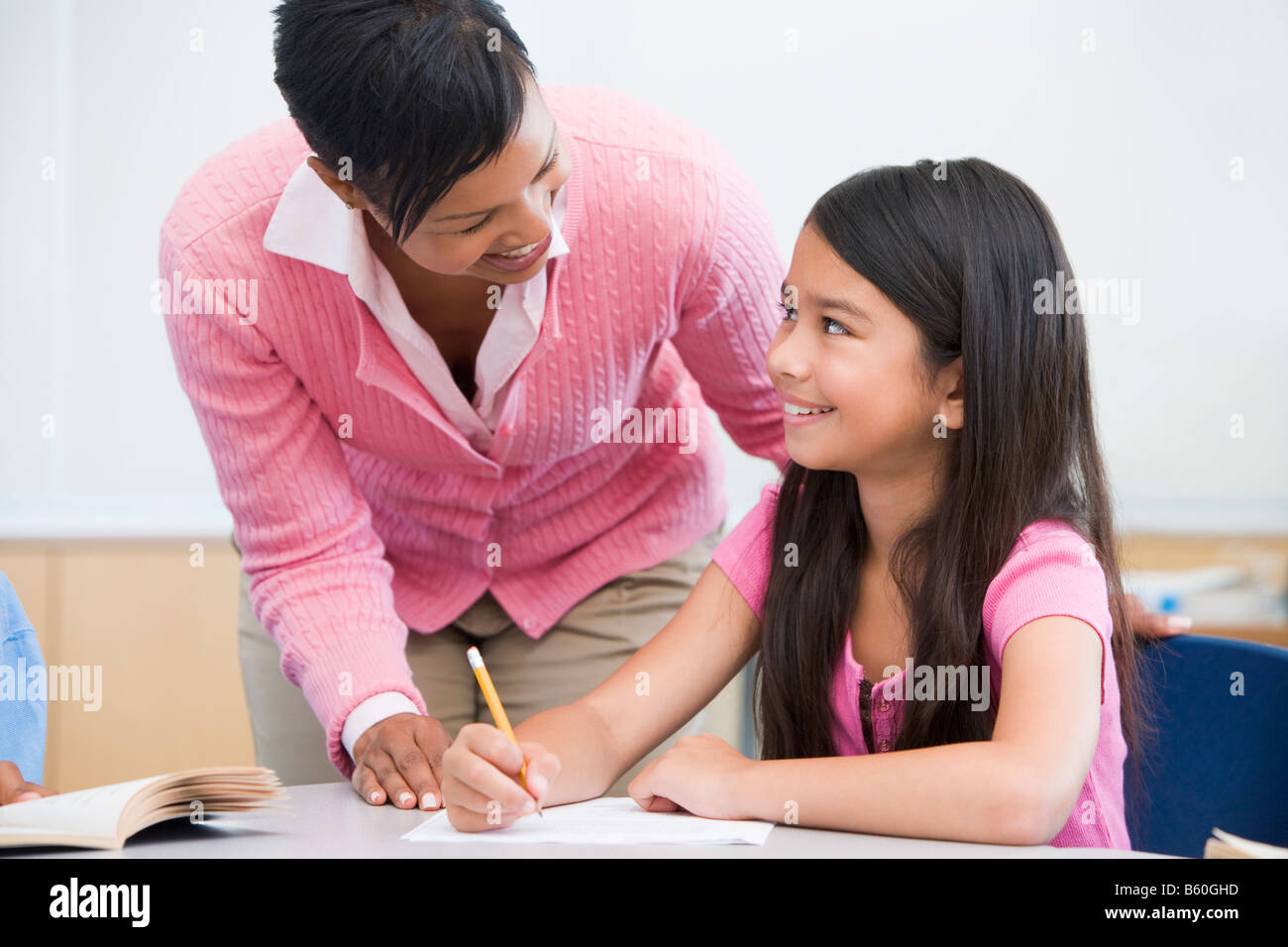 Teen students working together teacher hi-res stock photography and ...
