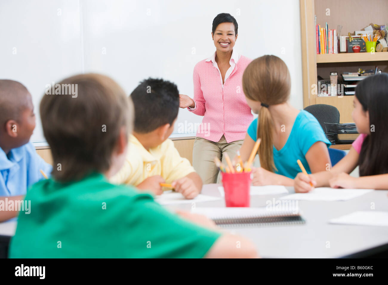 Students in class with teacher lecturing (selective focus Stock Photo ...