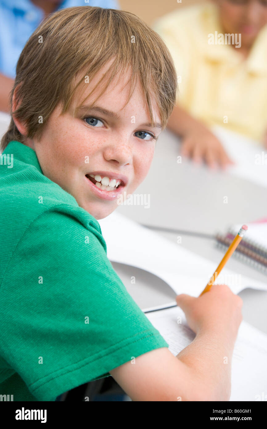Student in class writing (selective focus Stock Photo - Alamy