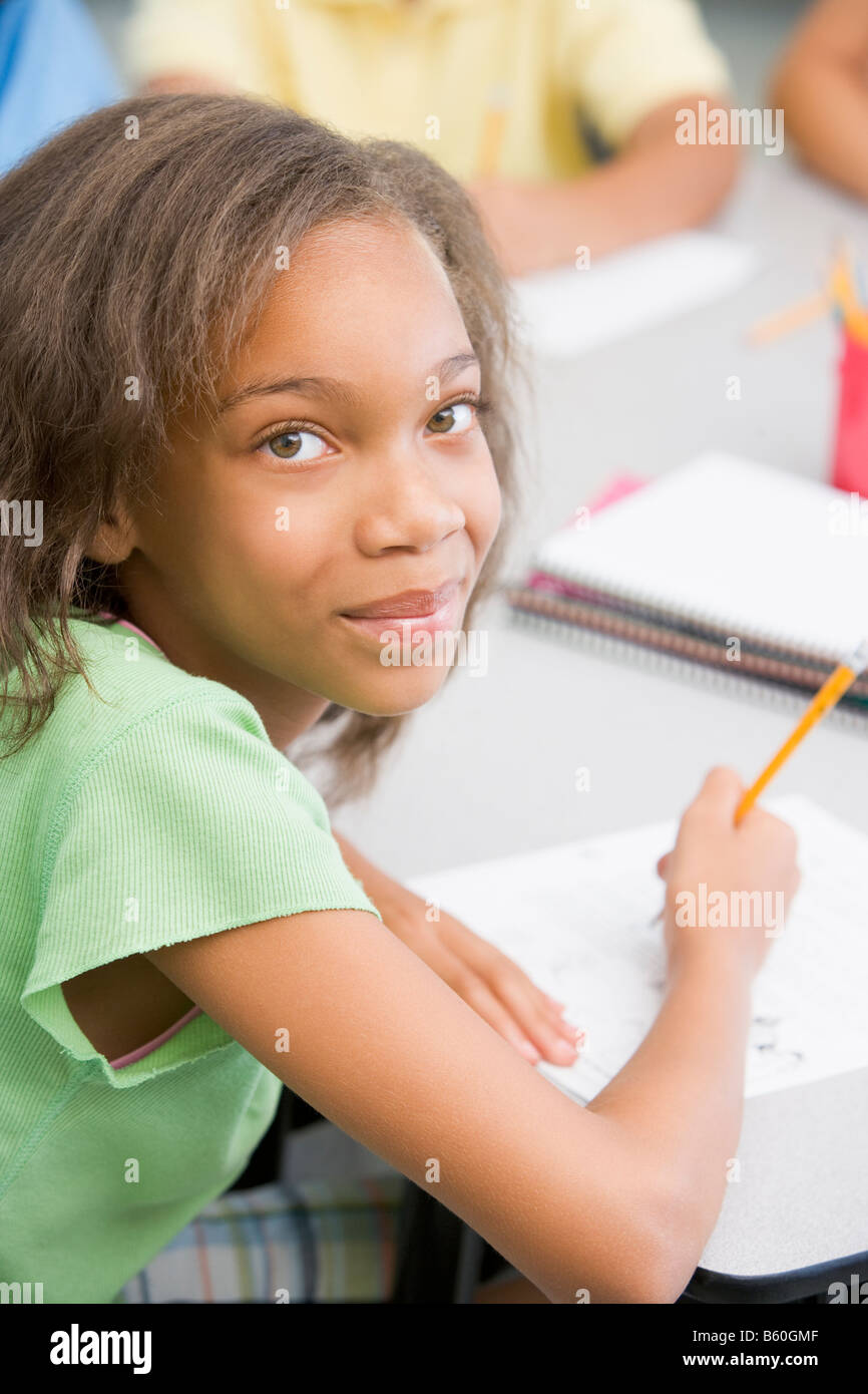 Student in class writing (selective focus Stock Photo - Alamy