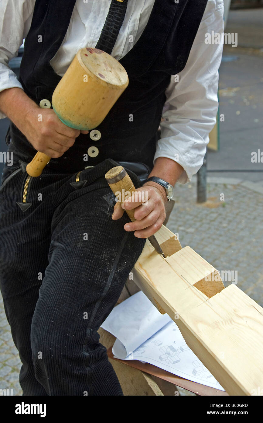 A carpenter at work in his uniform Stock Photo - Alamy
