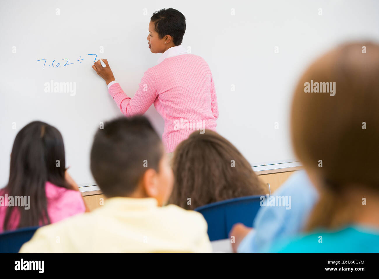 Teacher writing on board hi-res stock photography and images - Alamy