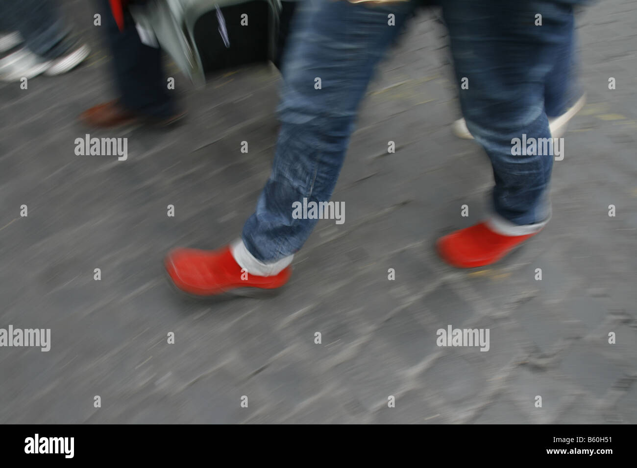 one person walking in street in city town Stock Photo - Alamy