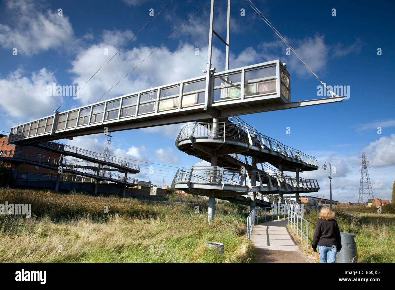 THE MODERN pedestrian FOOTBRIDGE OVER A RAILWAY TRACK LINKING STUDENT ...