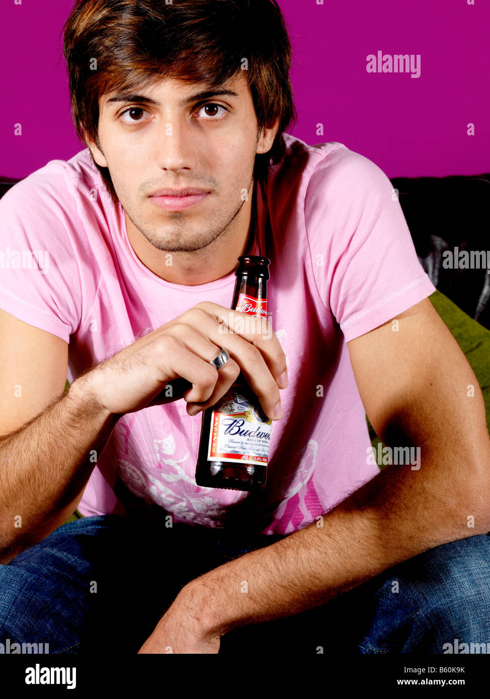 Male model bottle in hands hi-res stock photography and images - Alamy