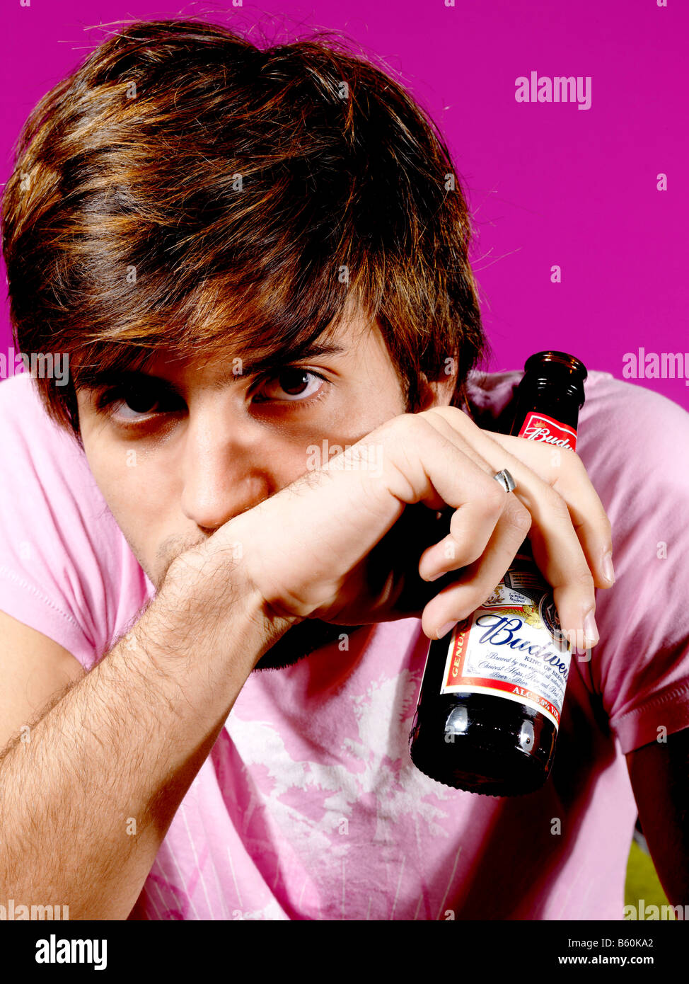 Male model bottle in hands hi-res stock photography and images - Alamy