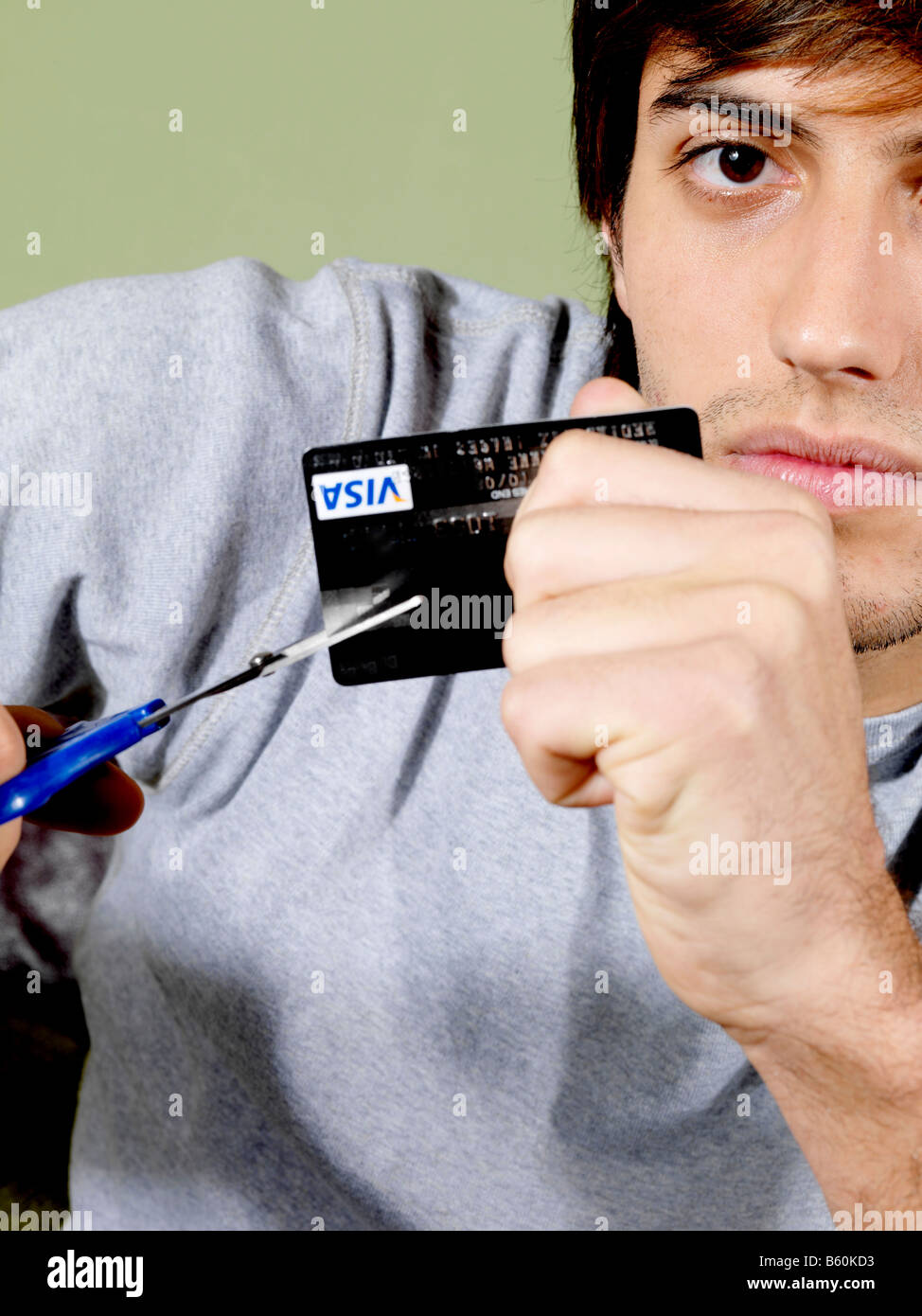 Young Man Cutting Up Credit Card Model Released Stock Photo - Alamy