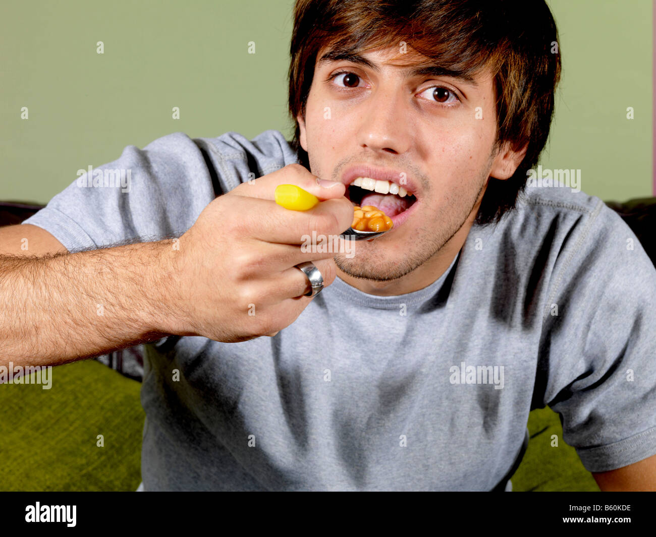 Young Man Eating Baked Beans Model Released Stock Photo - Alamy