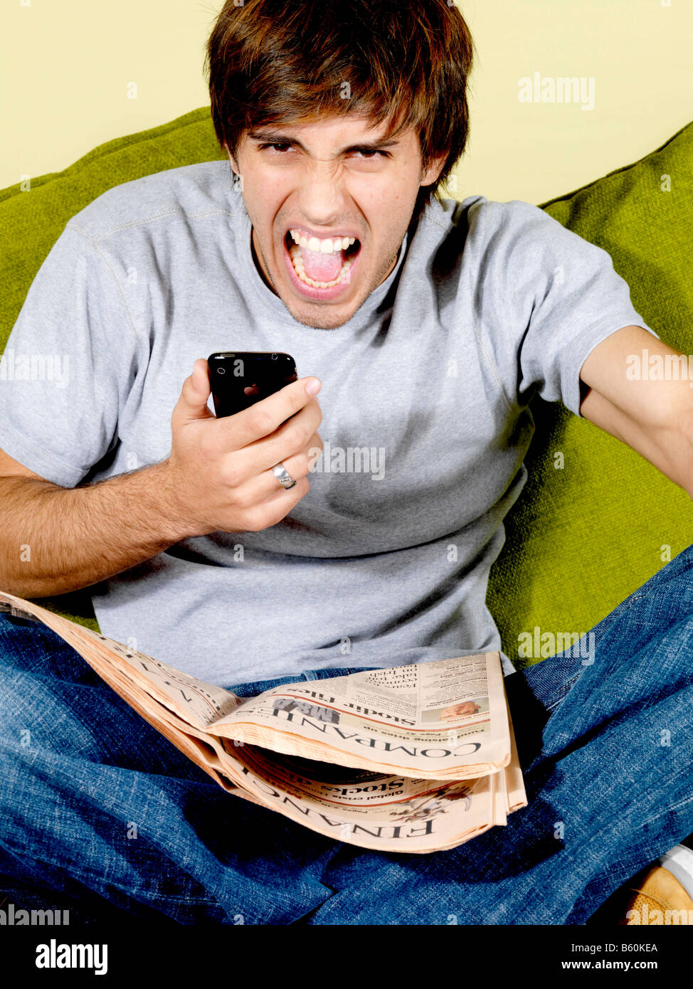 Angry Young Man Using Mobile Telephone Model Released Stock Photo - Alamy