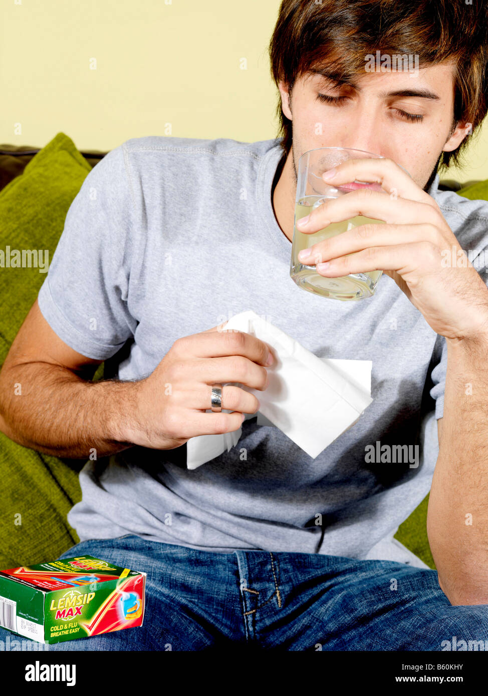 Young Man Drinking Soluble Medicine Model Released Stock Photo - Alamy