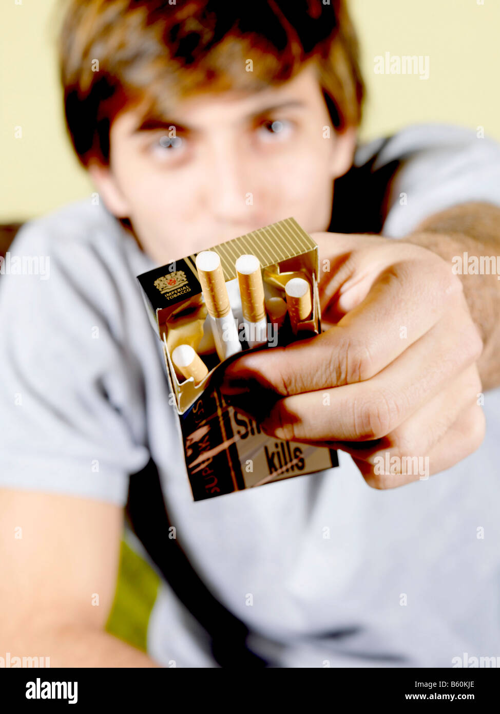 Young Man Offering Cigarettes Model Released Stock Photo - Alamy