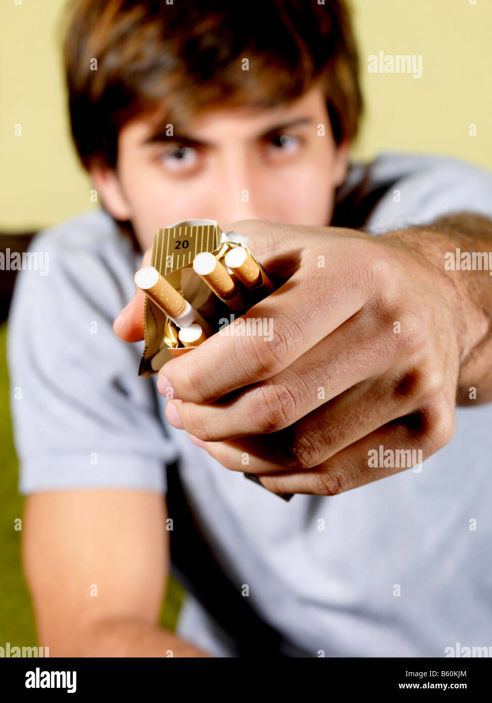 Young Man Offering Cigarettes Model Released Stock Photo - Alamy