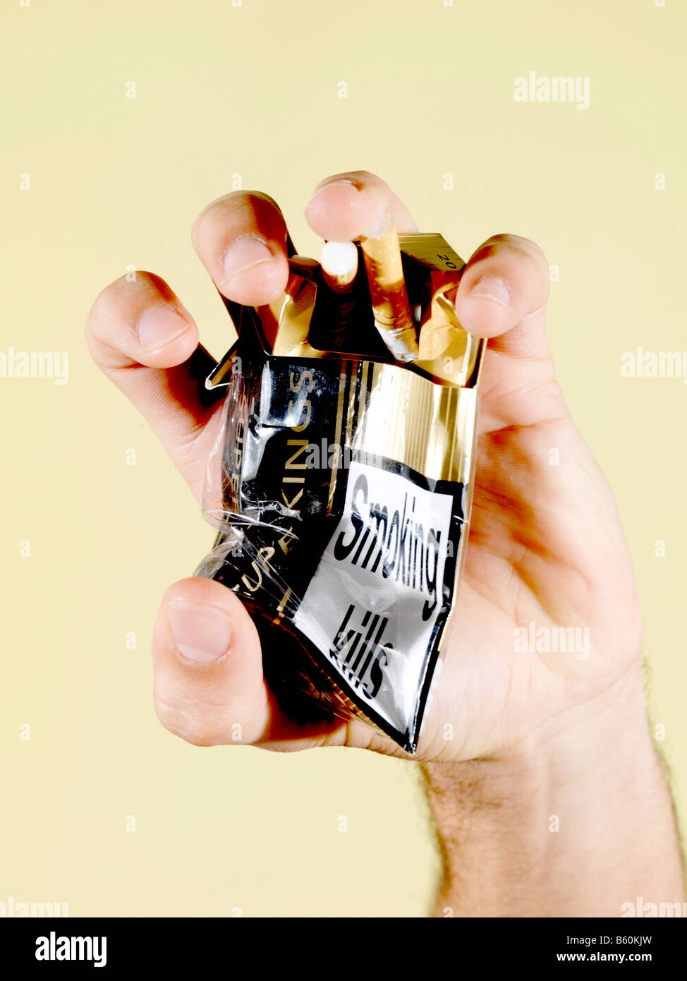 Young Man Squashing Cigarettes Model Released Stock Photo - Alamy