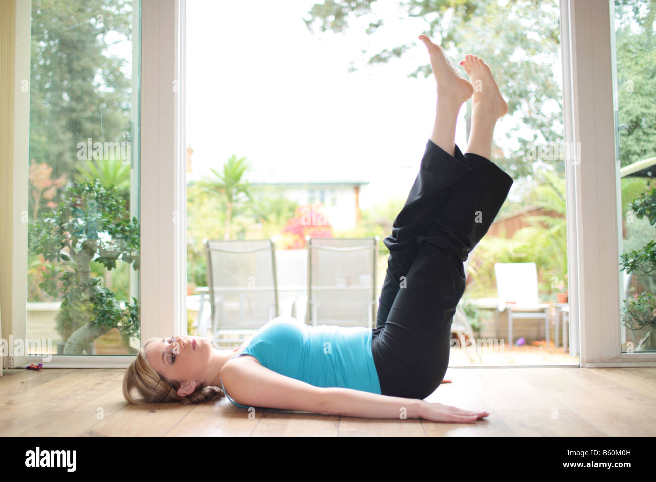 Young Woman Doing Scissor Exercise Model Released Stock Photo - Alamy
