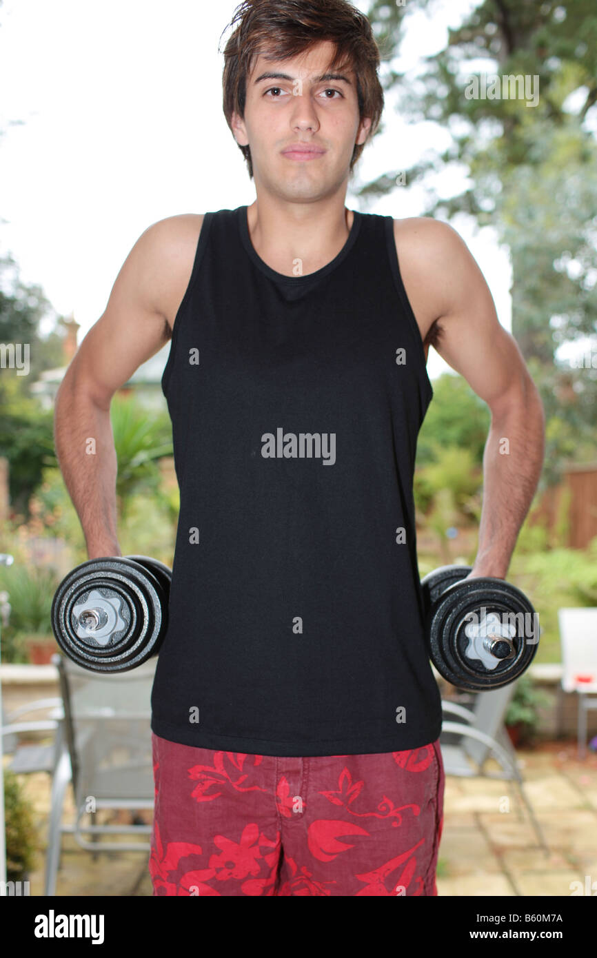 Young Man Lifting Weights Model Released Stock Photo - Alamy