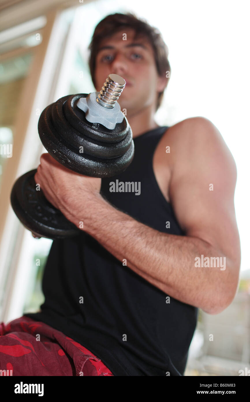 Teenage boy lifting weights hi-res stock photography and images - Alamy