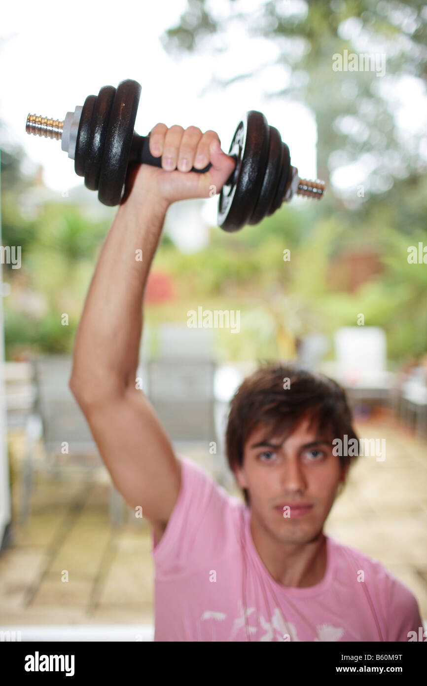 Teenage boy lifting weights hi-res stock photography and images - Alamy