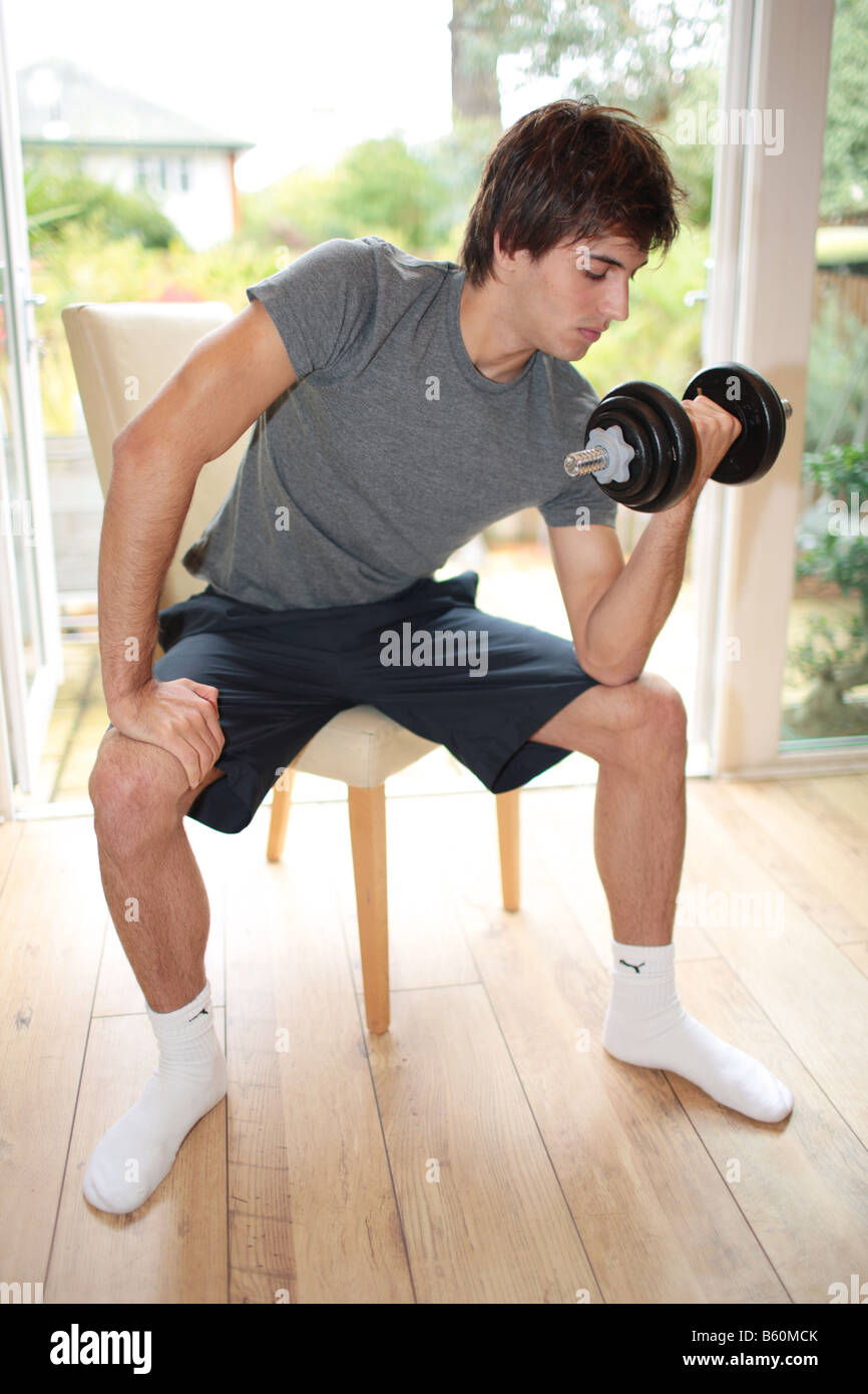 Young Man Lifting Weights Model Released Stock Photo - Alamy