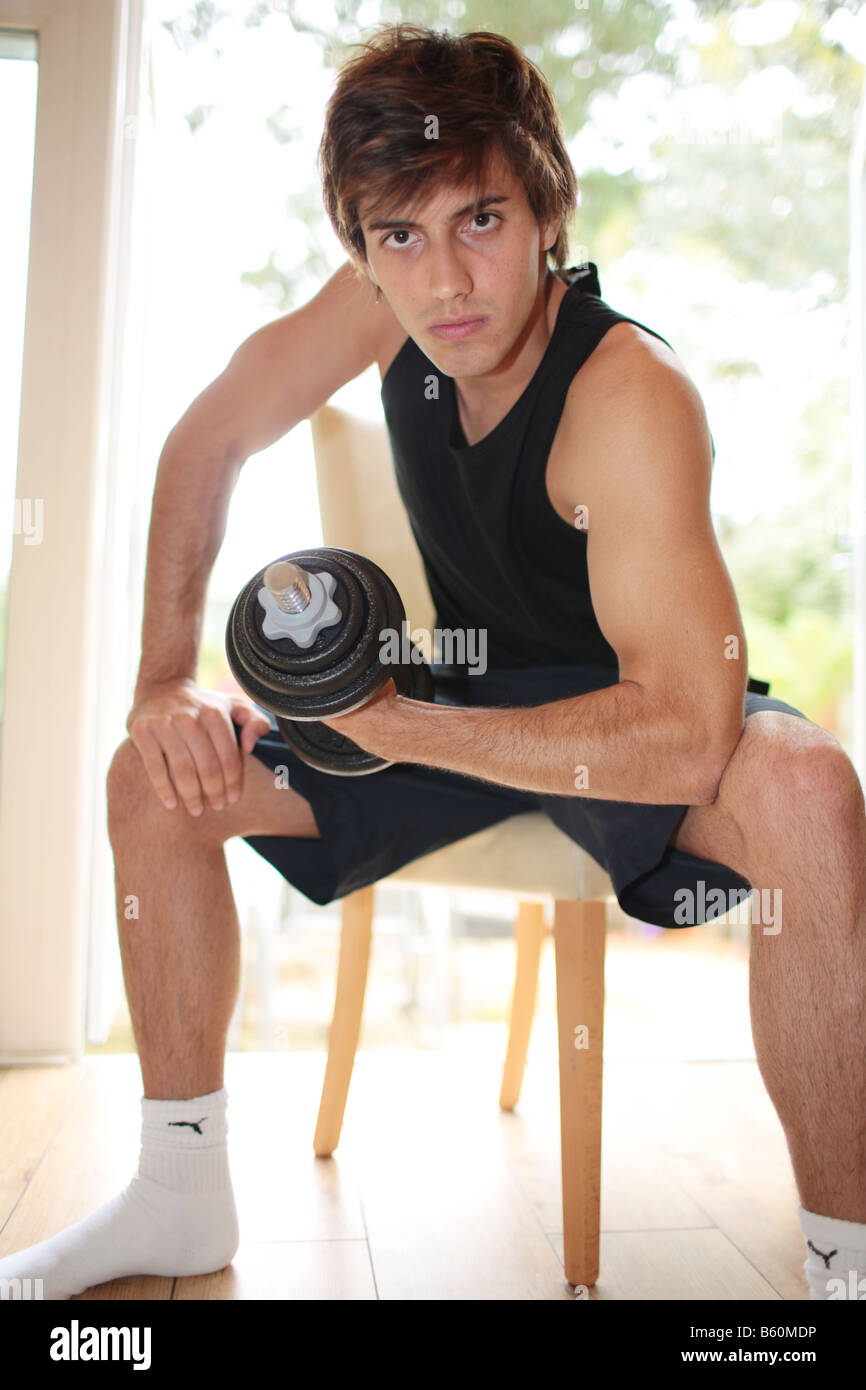 Young Man Lifting Weights Model Released Stock Photo - Alamy