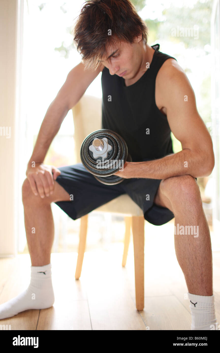Young Man Lifting Weights Model Released Stock Photo - Alamy