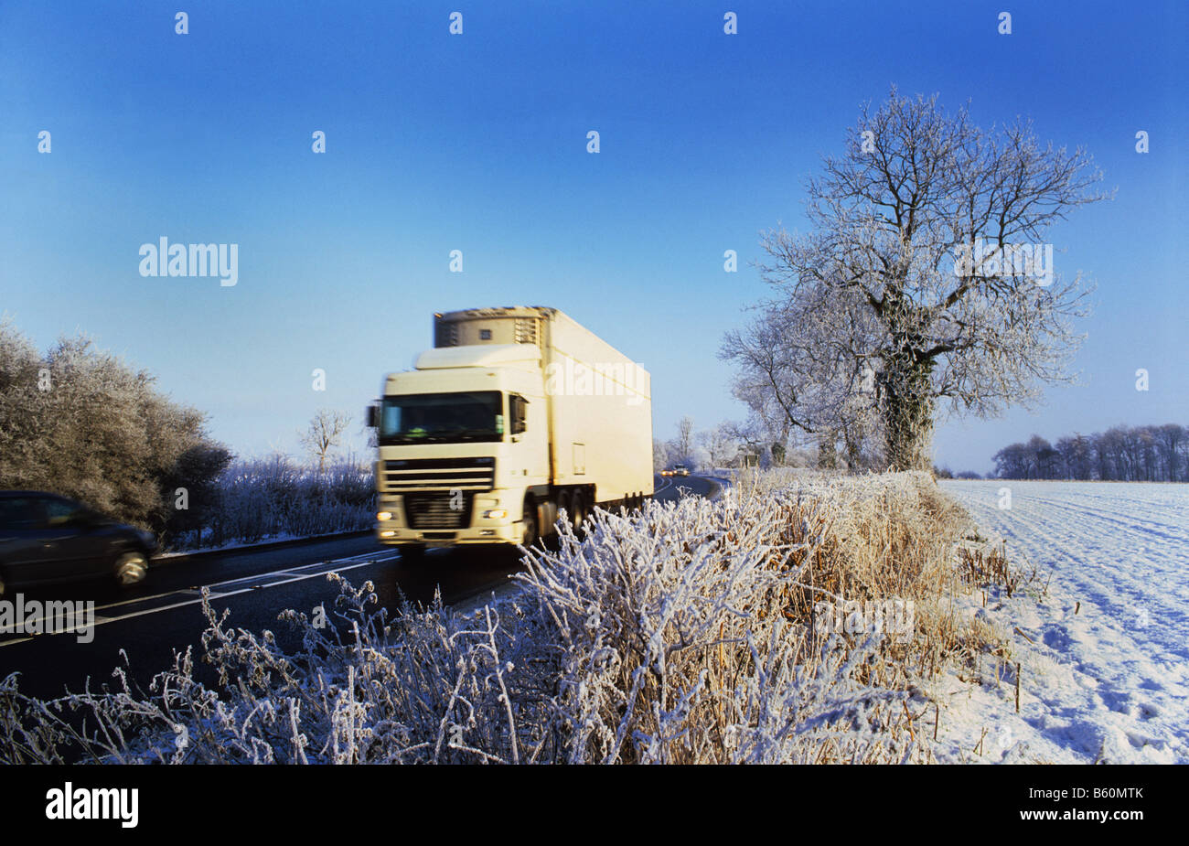 lorry travelling through winter snow on the A64 near York Yorkshire UK ...